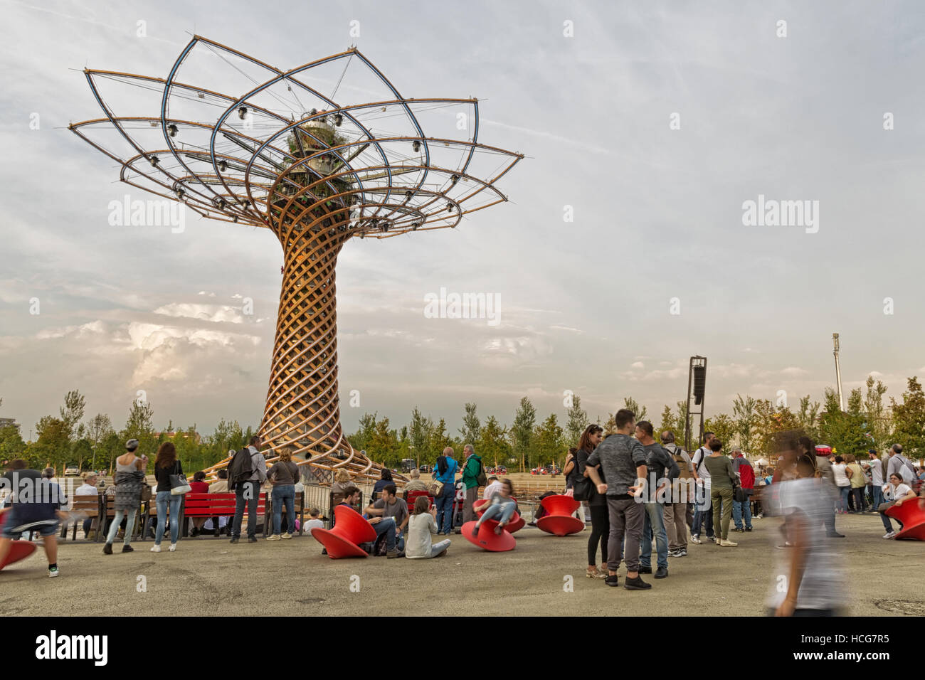 MILAN, ITALY - September 2015: People sit in front of the tree of life ...
