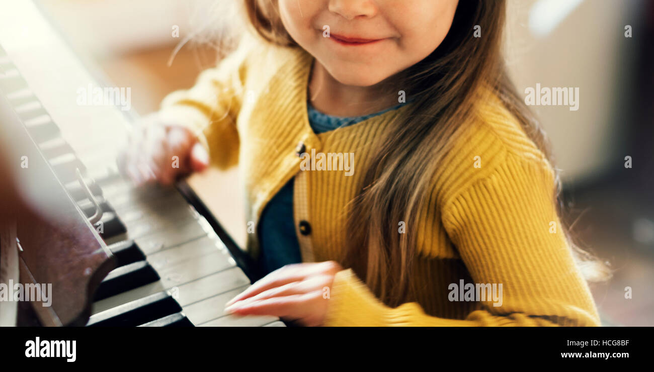 Adorable Cute Girl Playing Piano Concept Stock Photo - Alamy