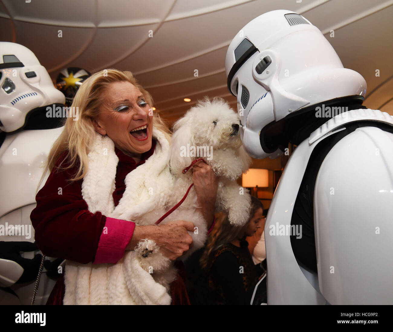 Donna Maria, dressed as Miss Christmas, with her dog Snowflake, with a ...