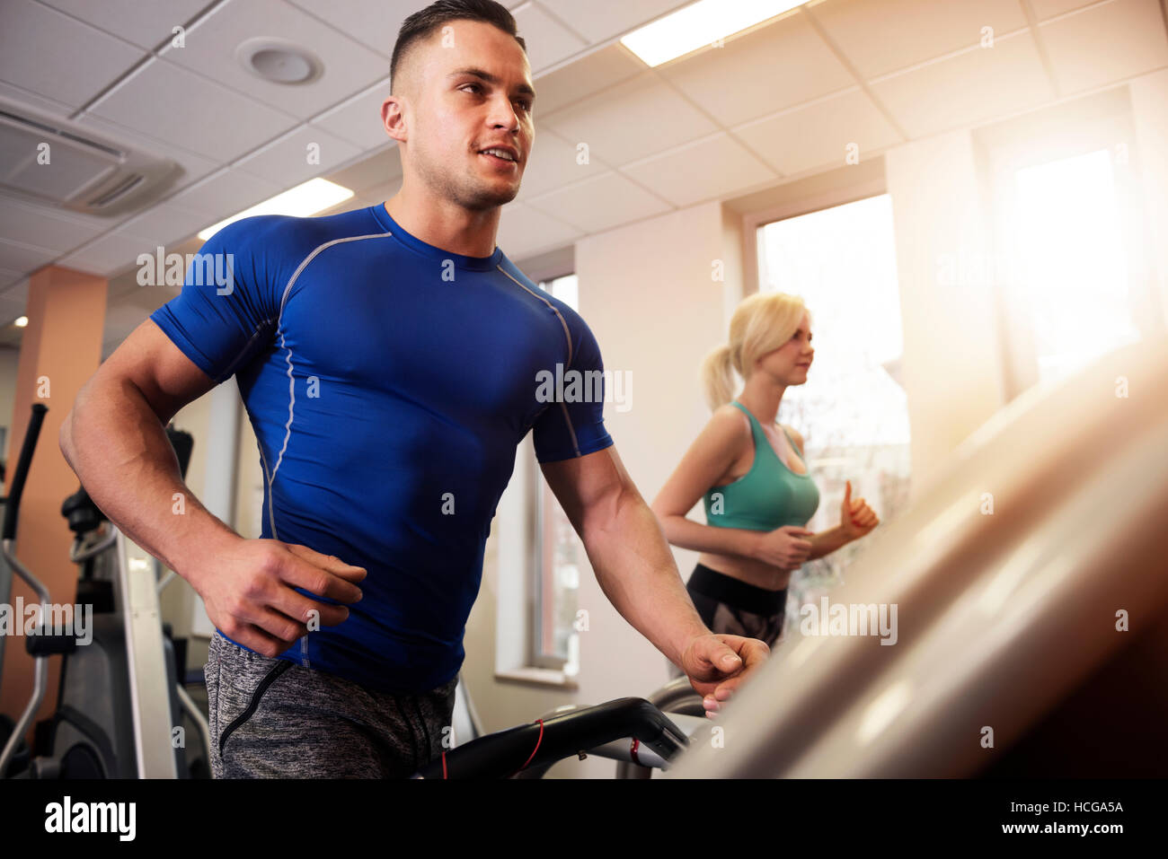 Young couple enjoying their workout Stock Photo - Alamy