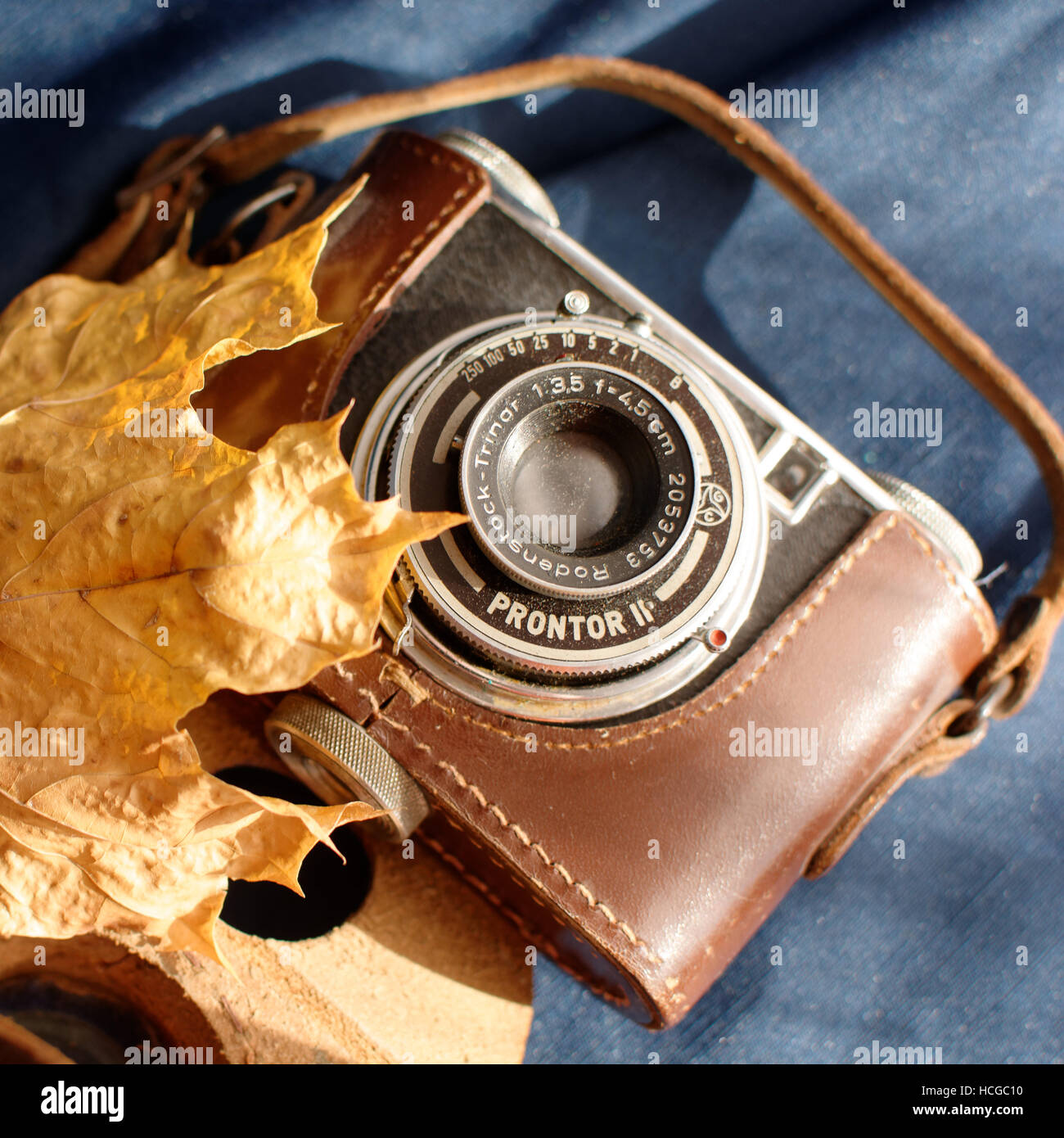 Vintage film camera against dark blue background Stock Photo - Alamy