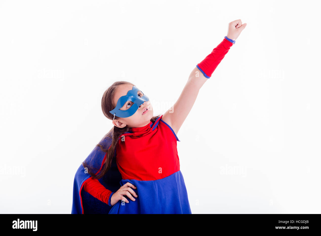 Girl in blue and red superhero costume with hand stretched out to fly ...