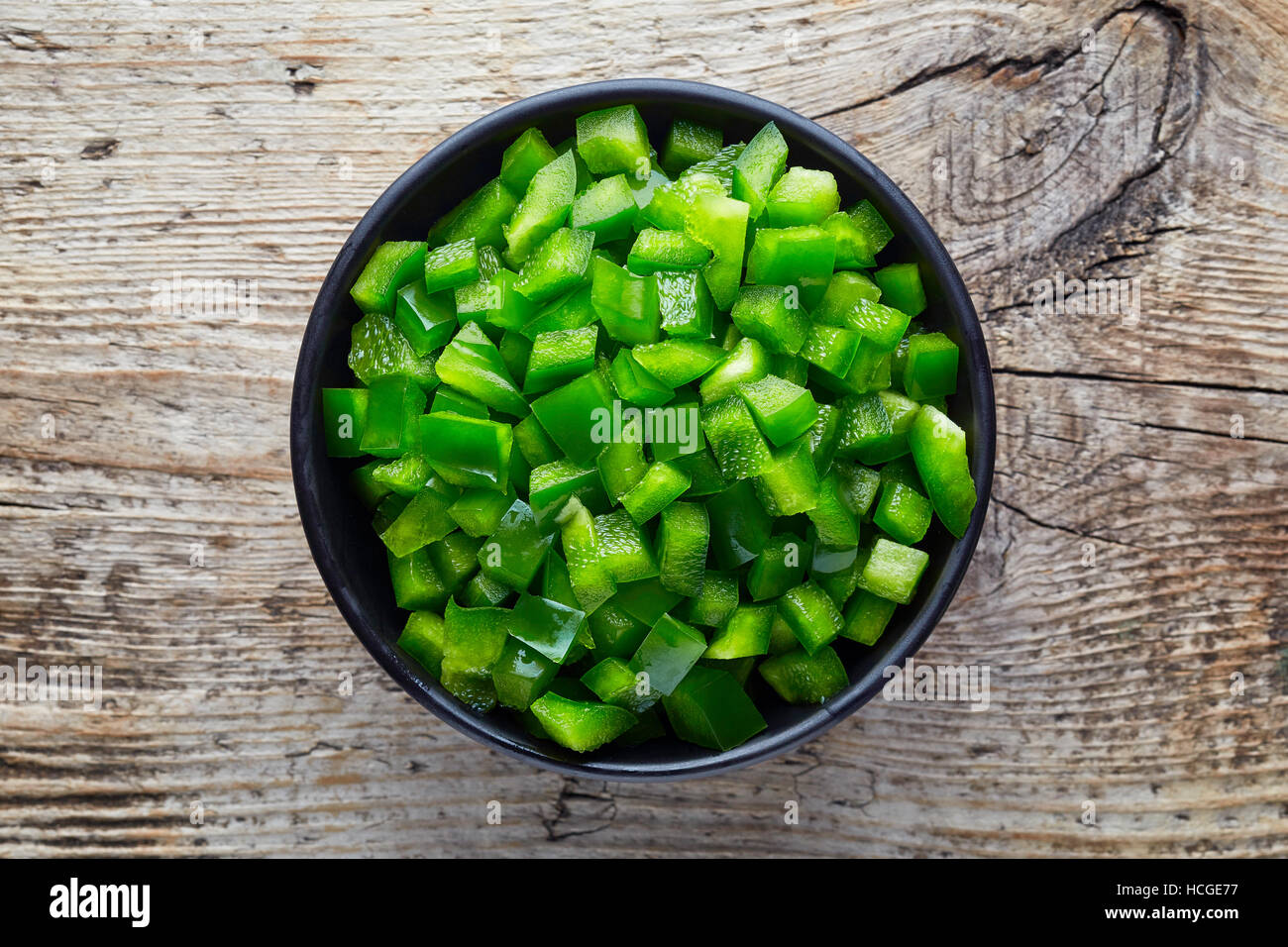 Bowl of chopped bell pepper on wooden background, top view Stock Photo ...