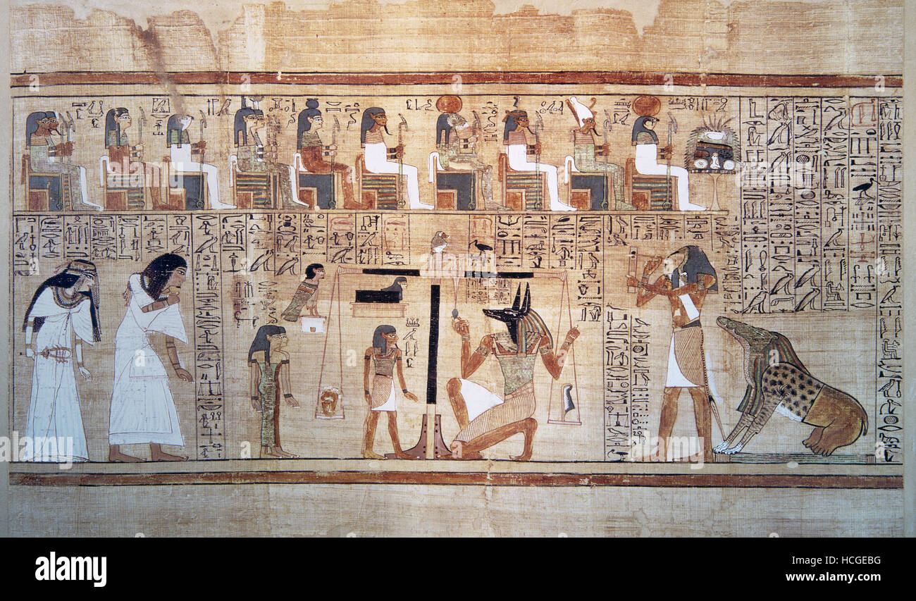 Weighing of souls. Anubis weighs the heart of Apis under the watchful ...