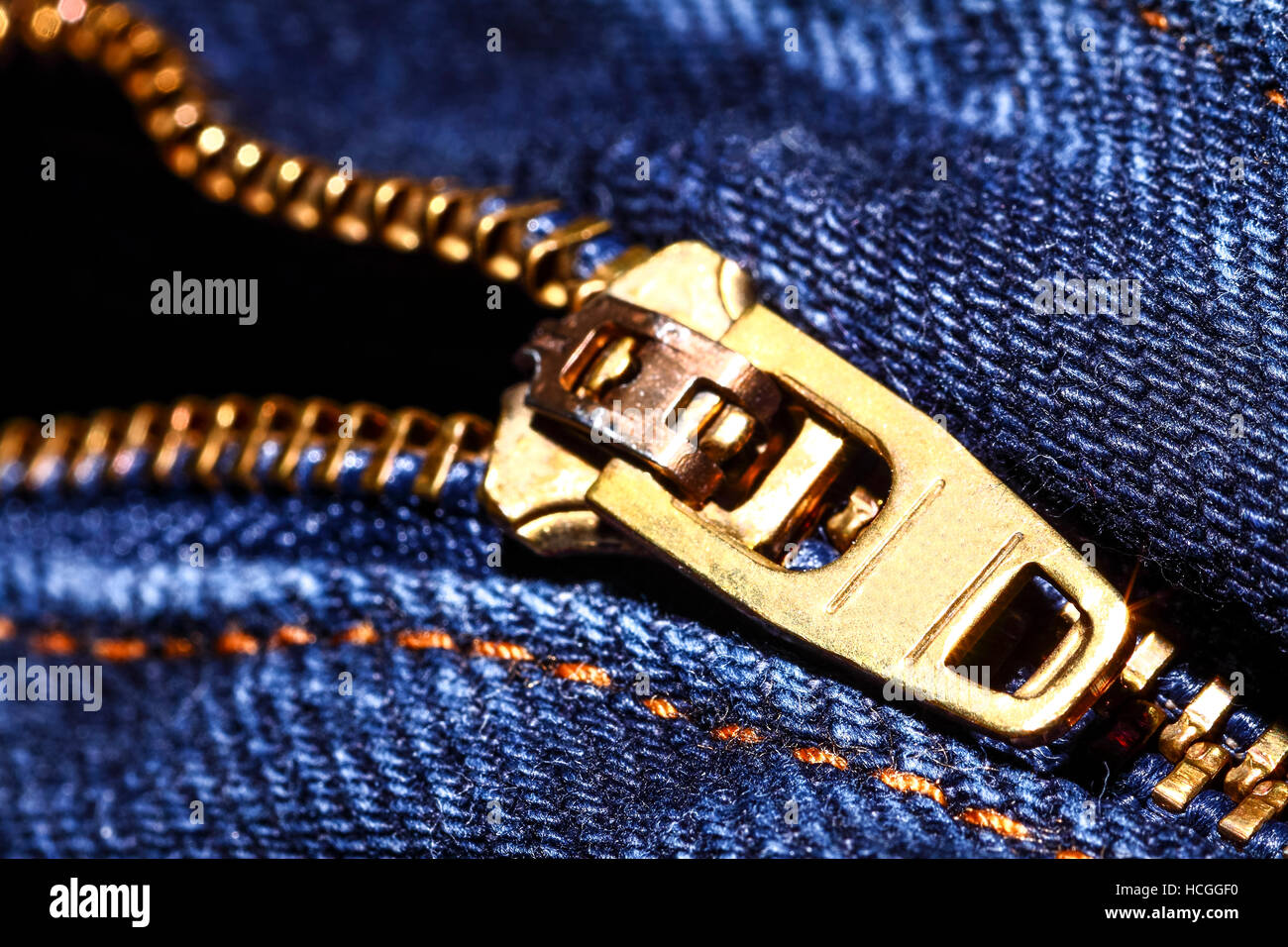 Zip (zipper) on blue cotton woven denim material Stock Photo - Alamy