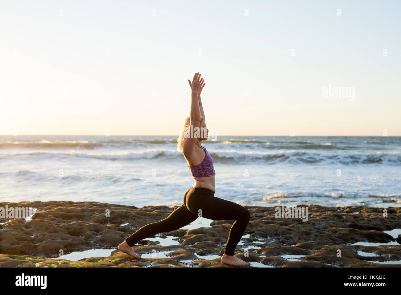 Yoga on the beach Stock Photo - Alamy