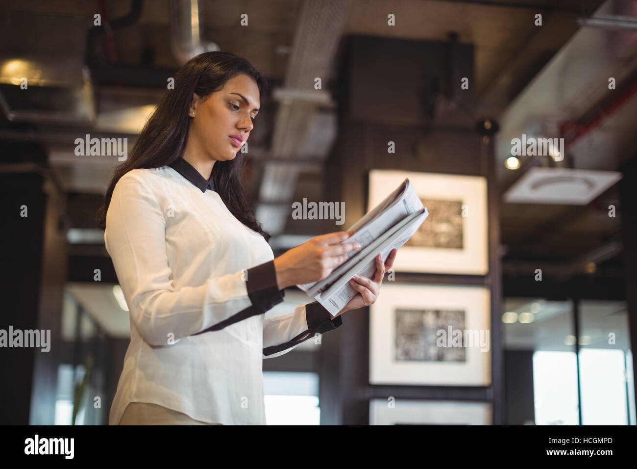 Young entrepreneur reading document hi-res stock photography and images ...