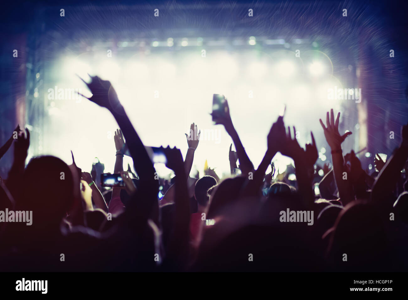 People dancing and cheering at music festival Stock Photo - Alamy