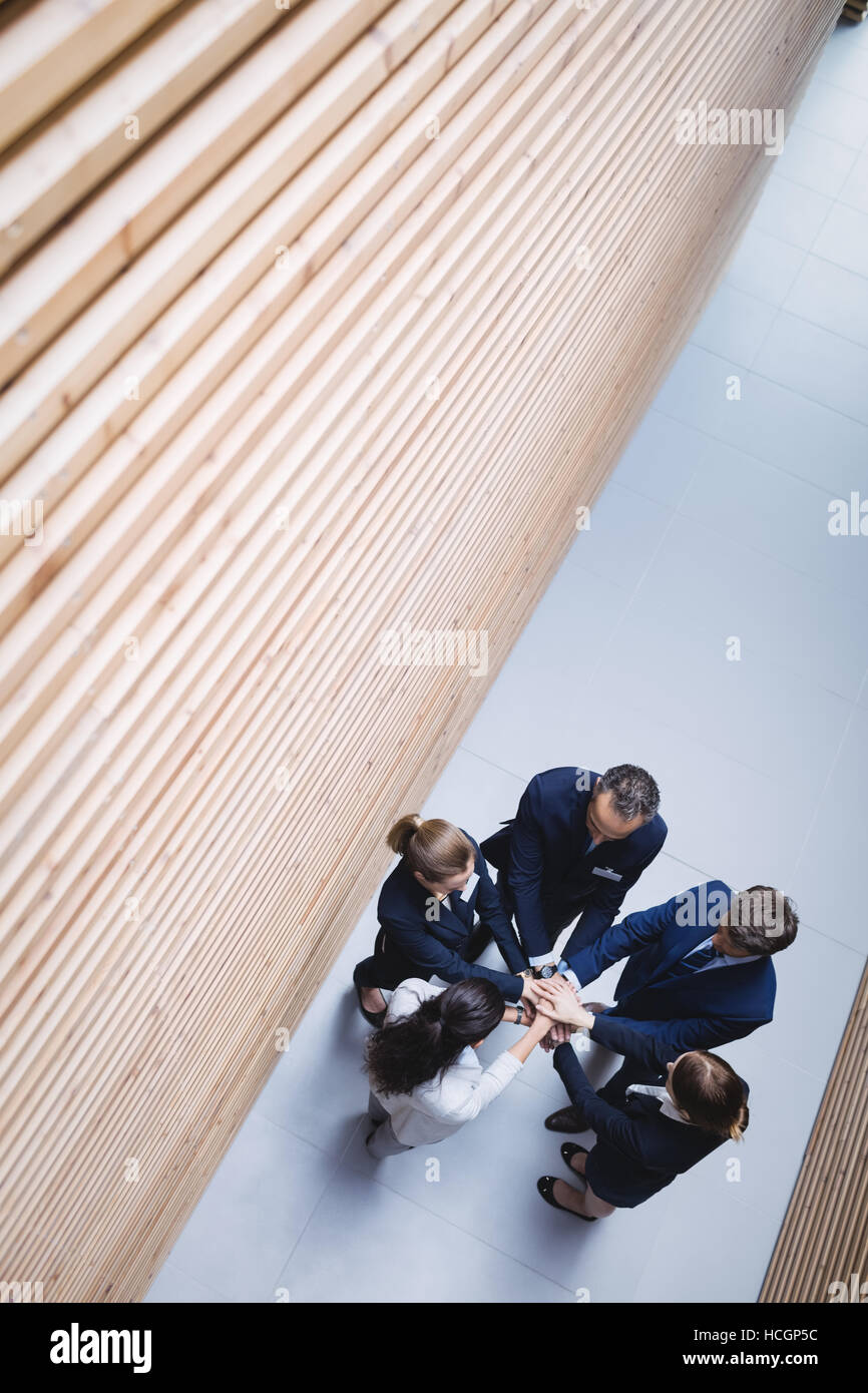 Businesspeople stacking hands together Stock Photo - Alamy