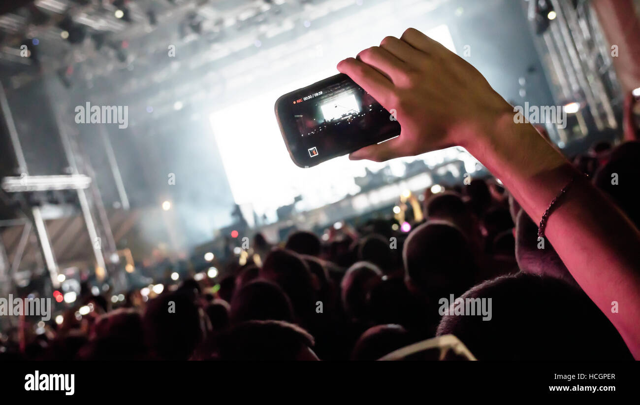 Taking photo at concert hi-res stock photography and images - Alamy