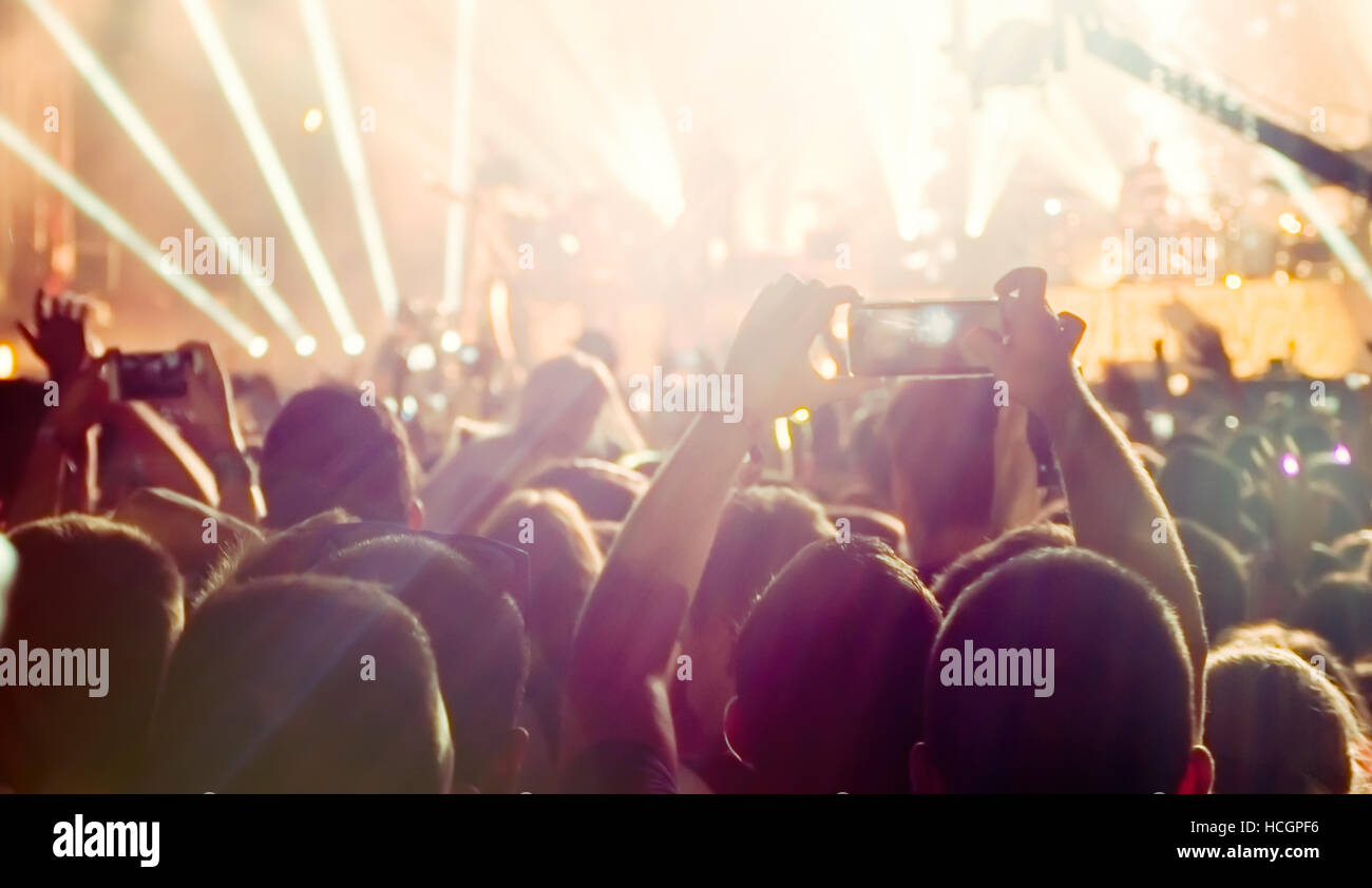 Fan taking photo of concert at festival Stock Photo - Alamy