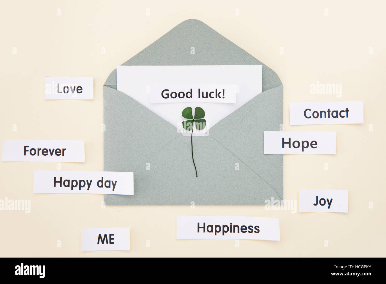 Letter with four-leaf clover and various English words Stock Photo - Alamy