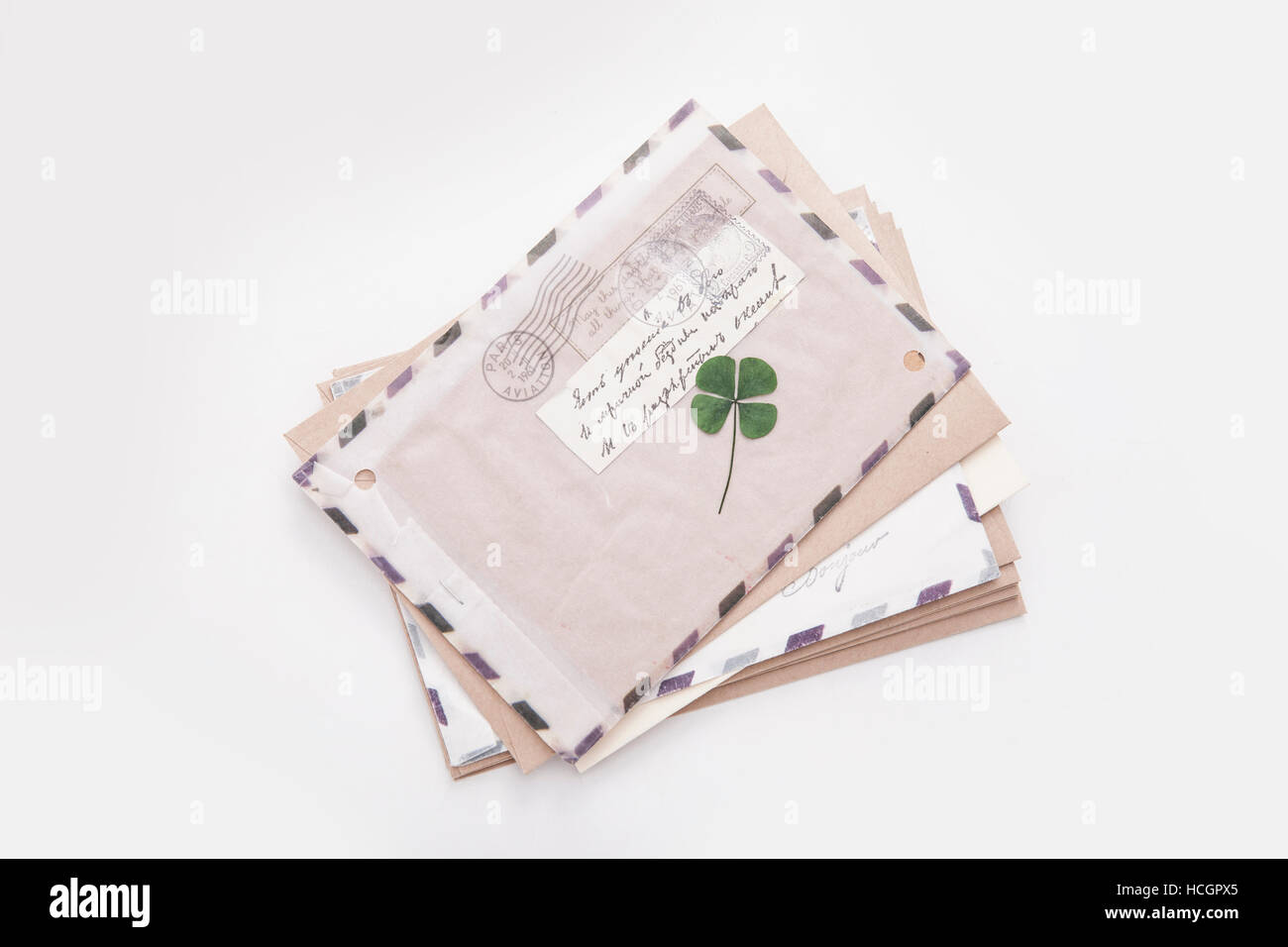 Letter with four-leaf clover Stock Photo - Alamy