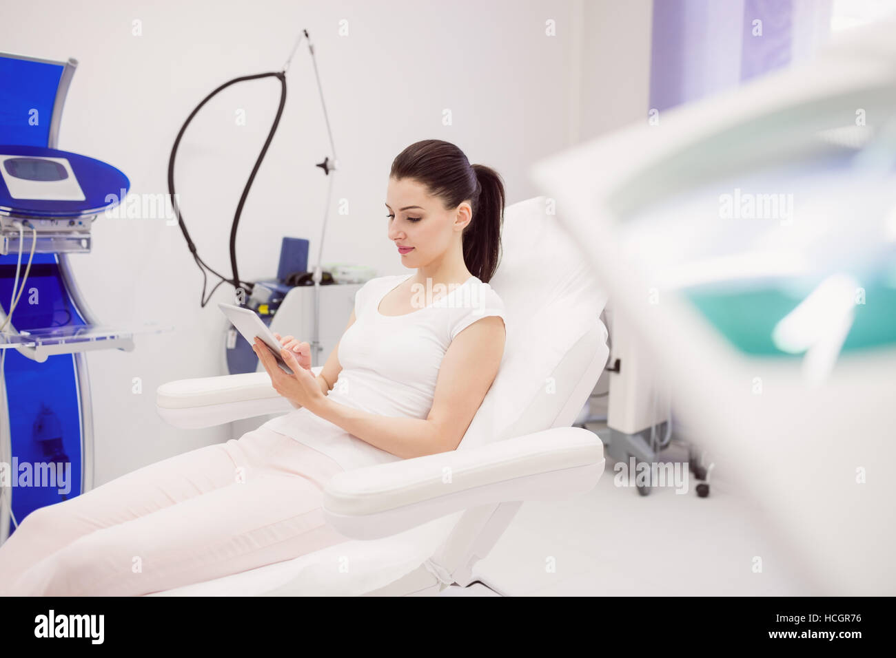 Beautiful women using digital tablet Stock Photo - Alamy