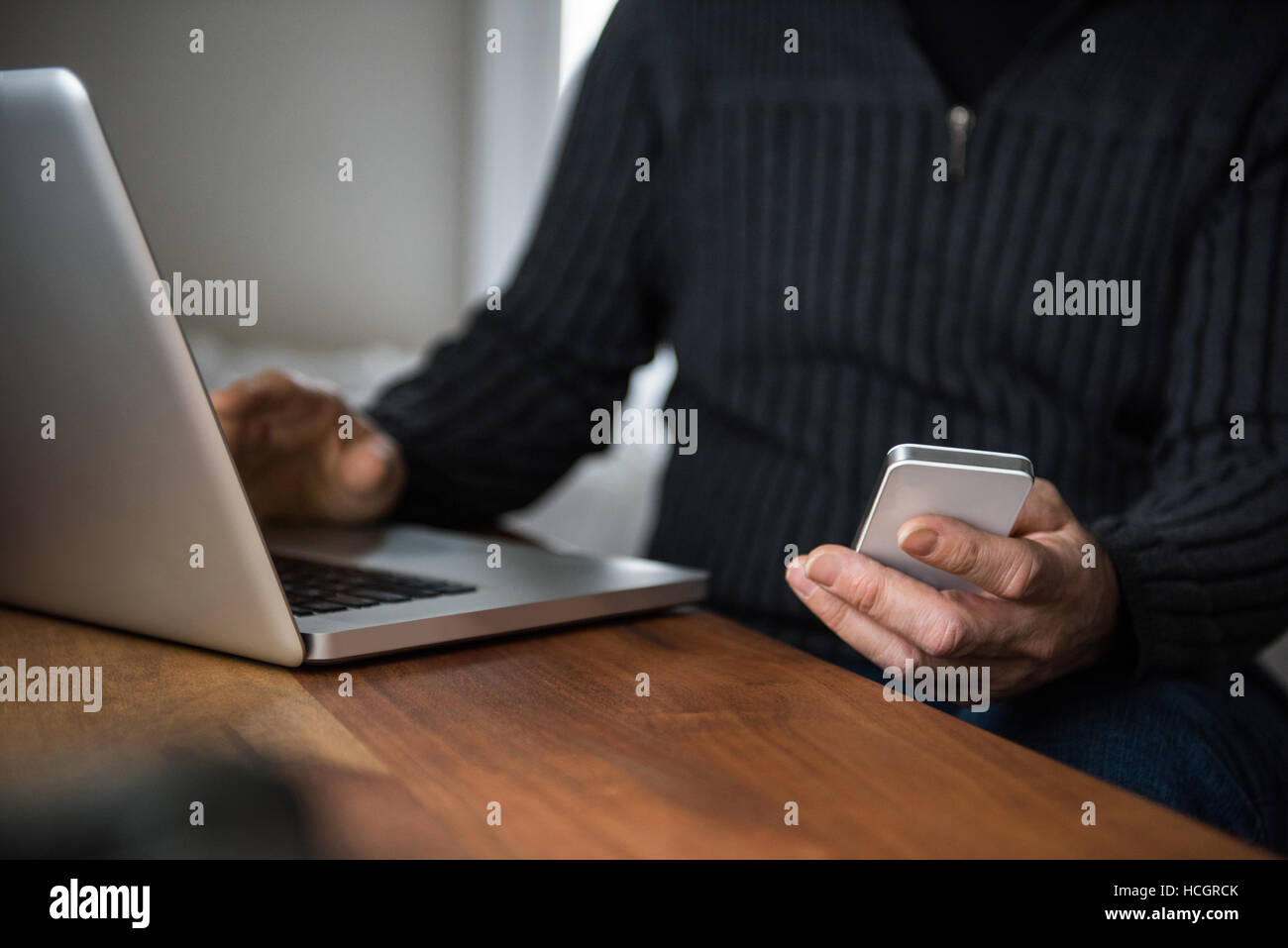 Man using mobile smartphone home hi-res stock photography and images ...