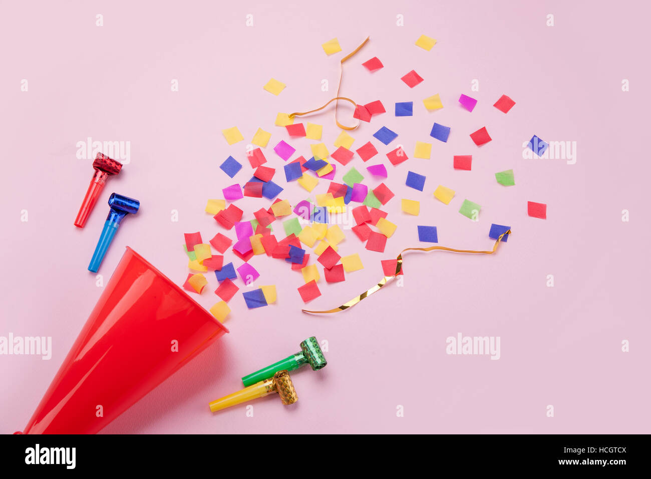 Cheering tools with confetti Stock Photo - Alamy