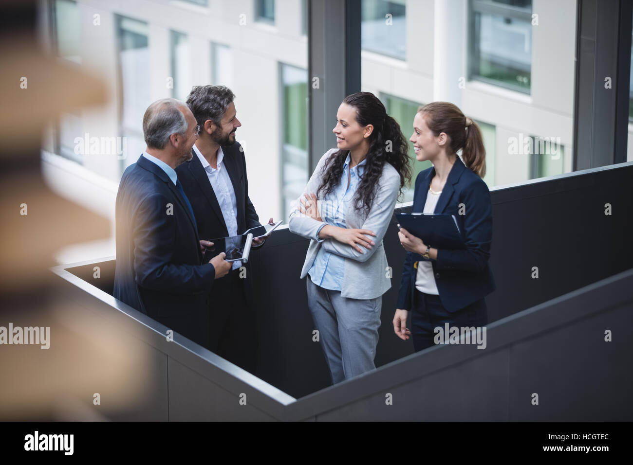 Businesspeople having a discussion in office Stock Photo - Alamy