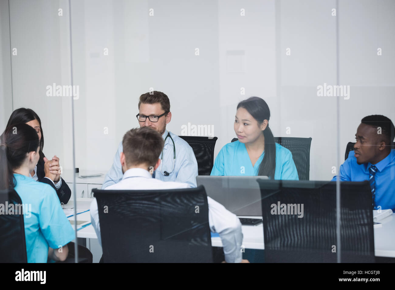Team of doctors in a meeting Stock Photo - Alamy