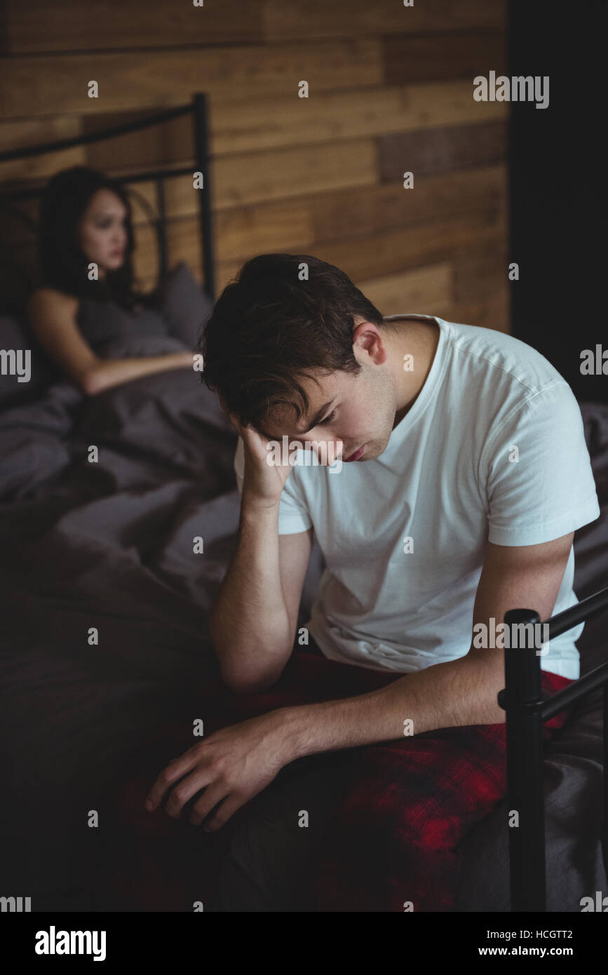 Upset couple ignoring each other after fight on bed Stock Photo - Alamy