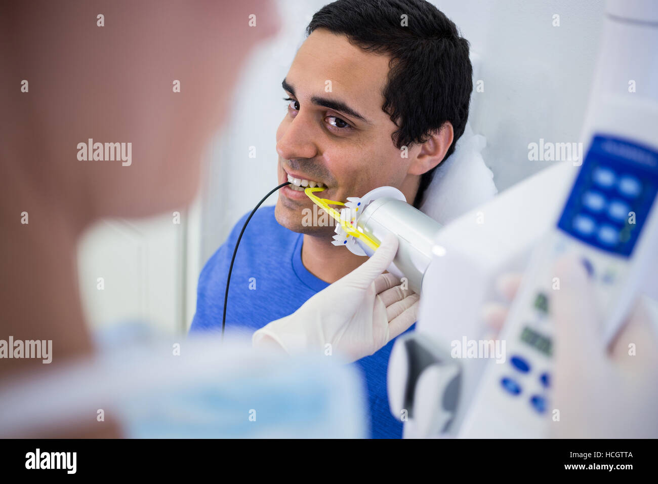 Dentist taking x-ray of patients teeth Stock Photo - Alamy