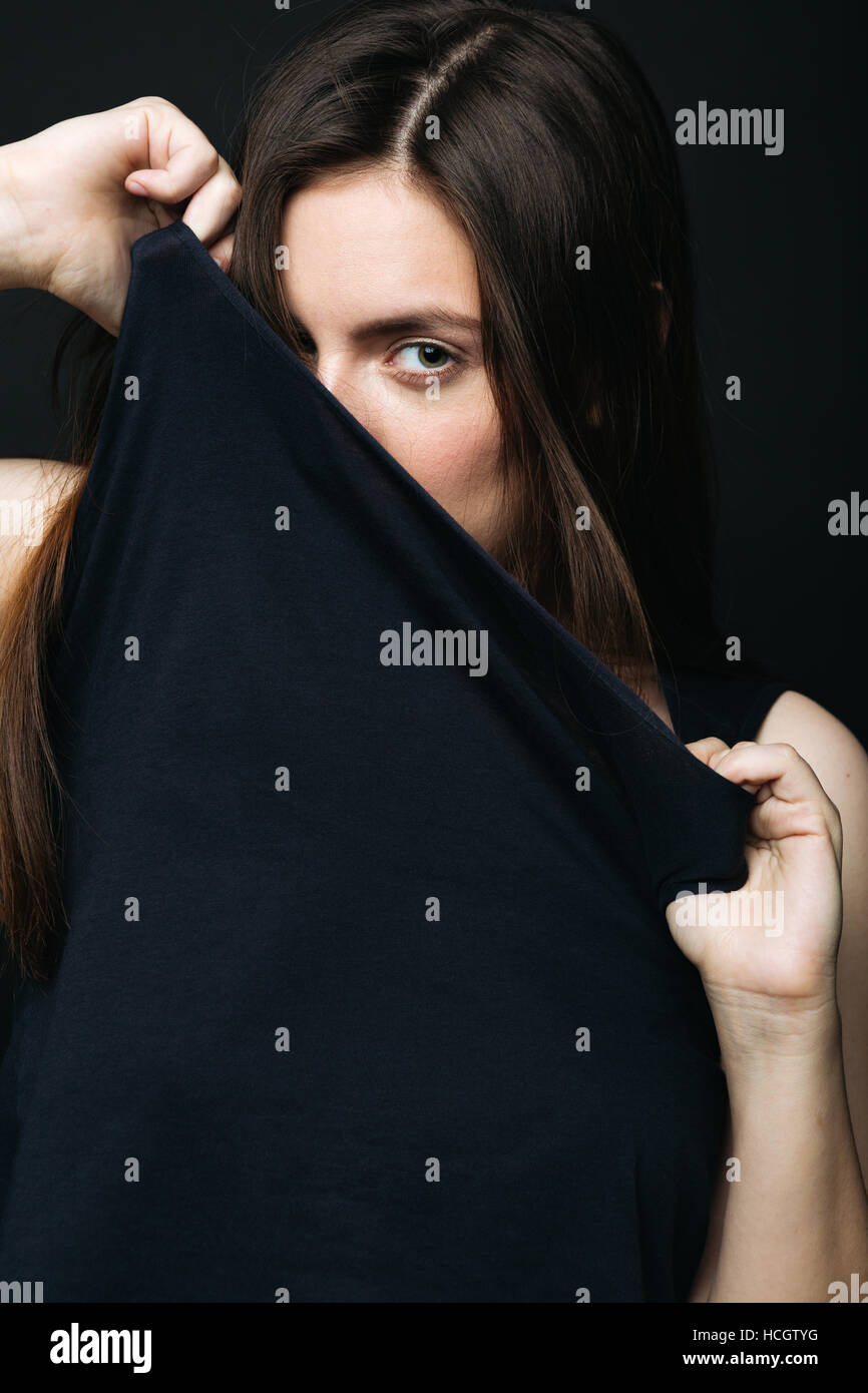 Woman covering her face with cloth Stock Photo - Alamy