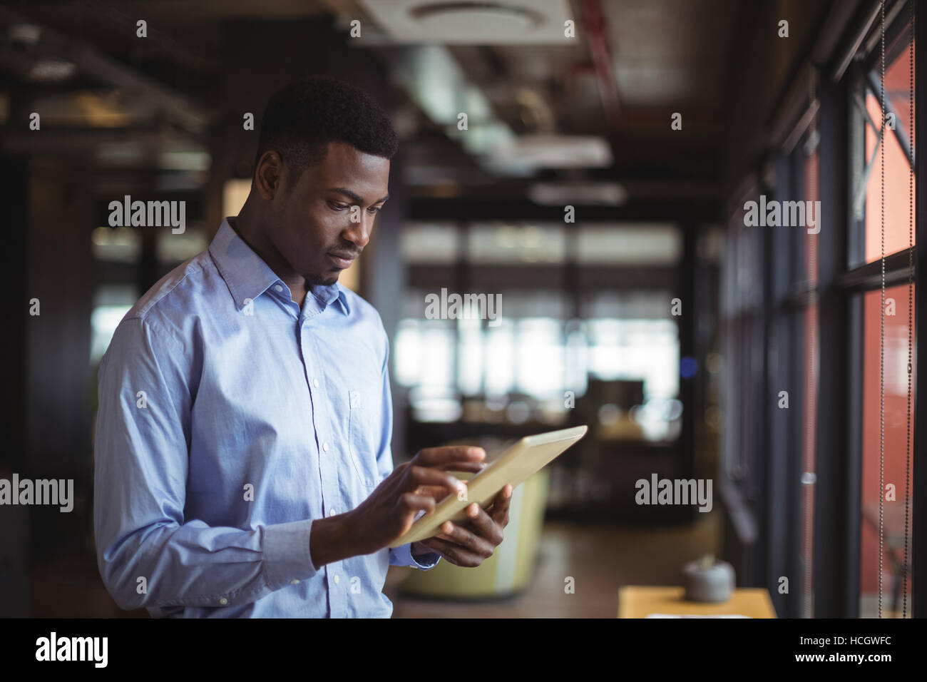 Focused businessman holding digital hi-res stock photography and images ...