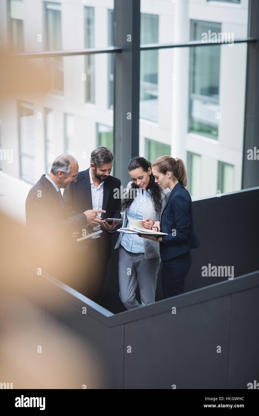 Businesspeople having a discussion in office Stock Photo - Alamy