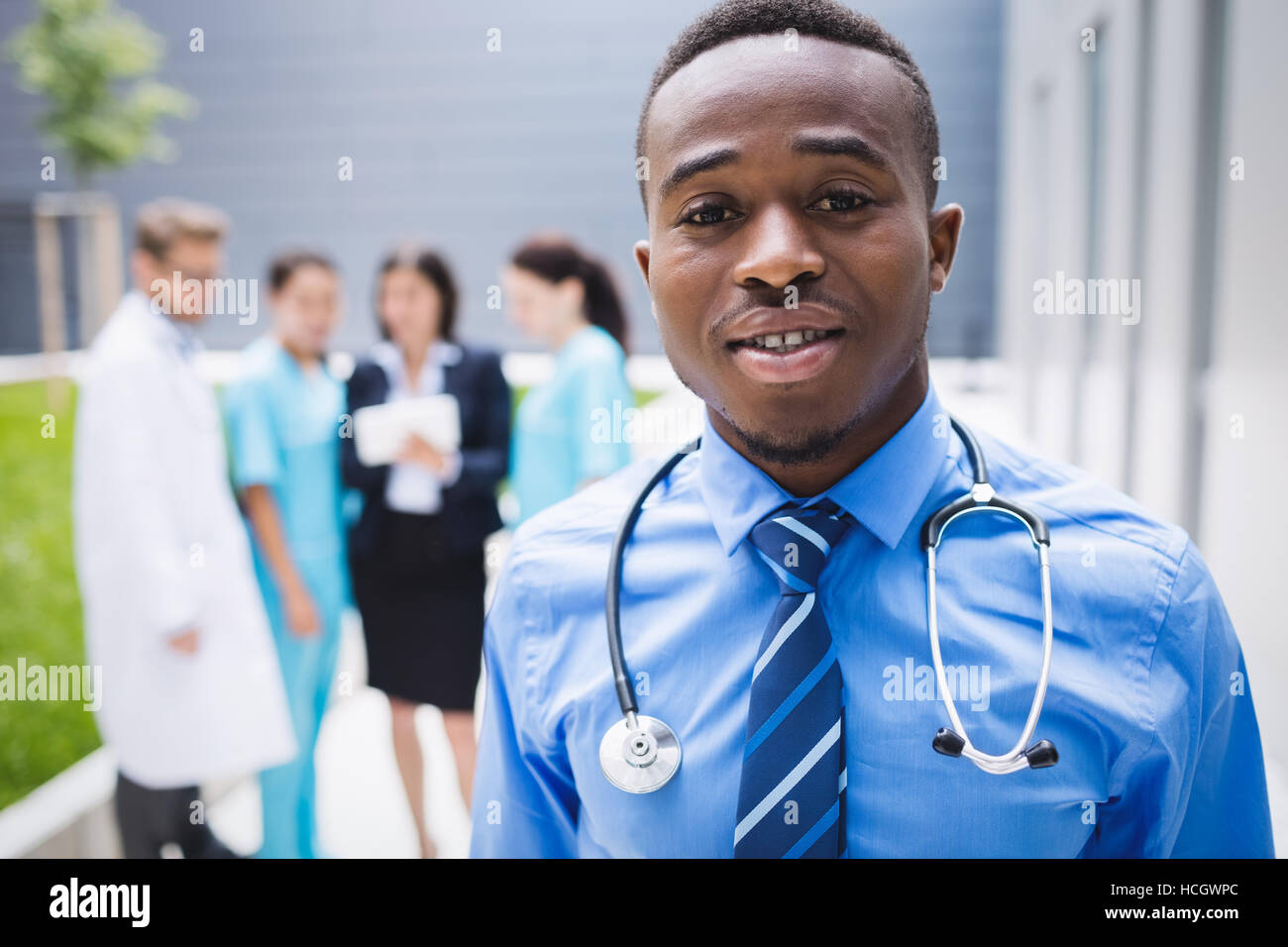 Doctor standing in hospital premises Stock Photo - Alamy