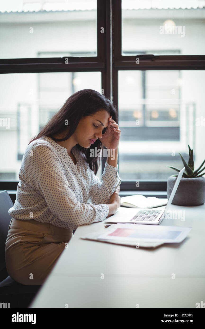 Sad entrepreneur sitting office desk hi-res stock photography and ...