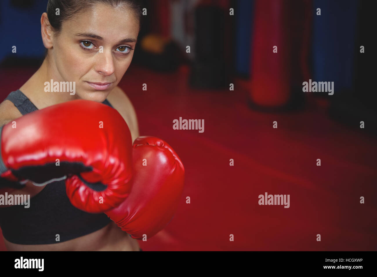 Confident female boxer performing boxing stance Stock Photo - Alamy