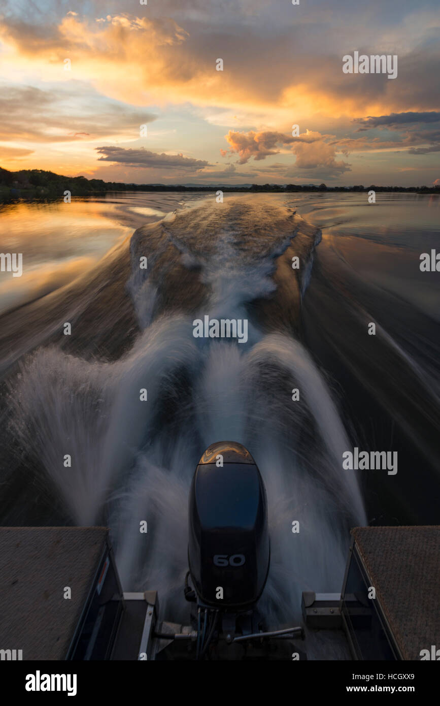 Zambezi River Zimbabwe boat motor wake fast sunset Stock Photo - Alamy
