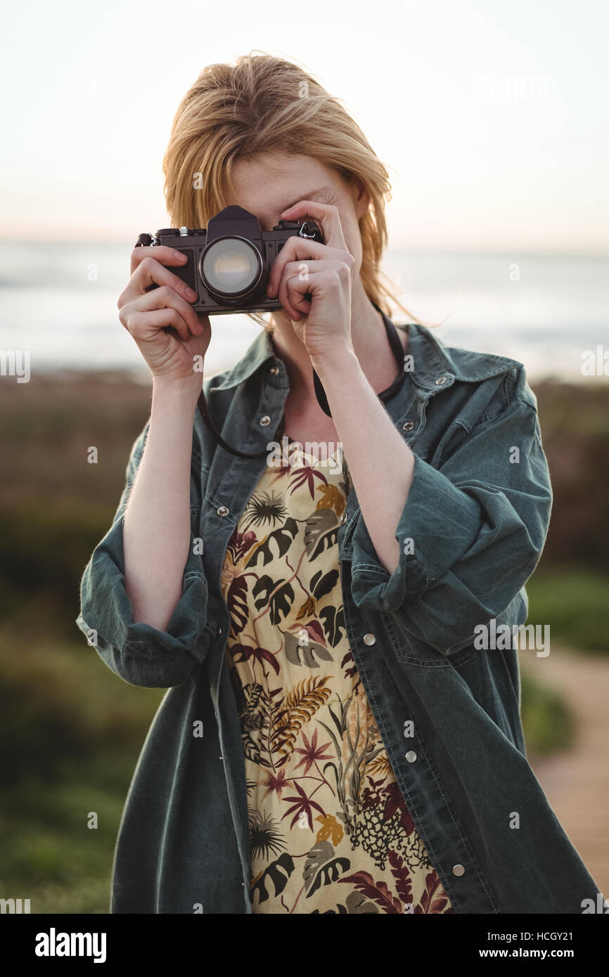 Woman taking photographs with digital camera Stock Photo - Alamy