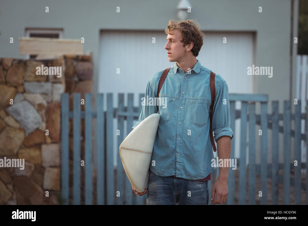 Man carrying a surfboard Stock Photo - Alamy