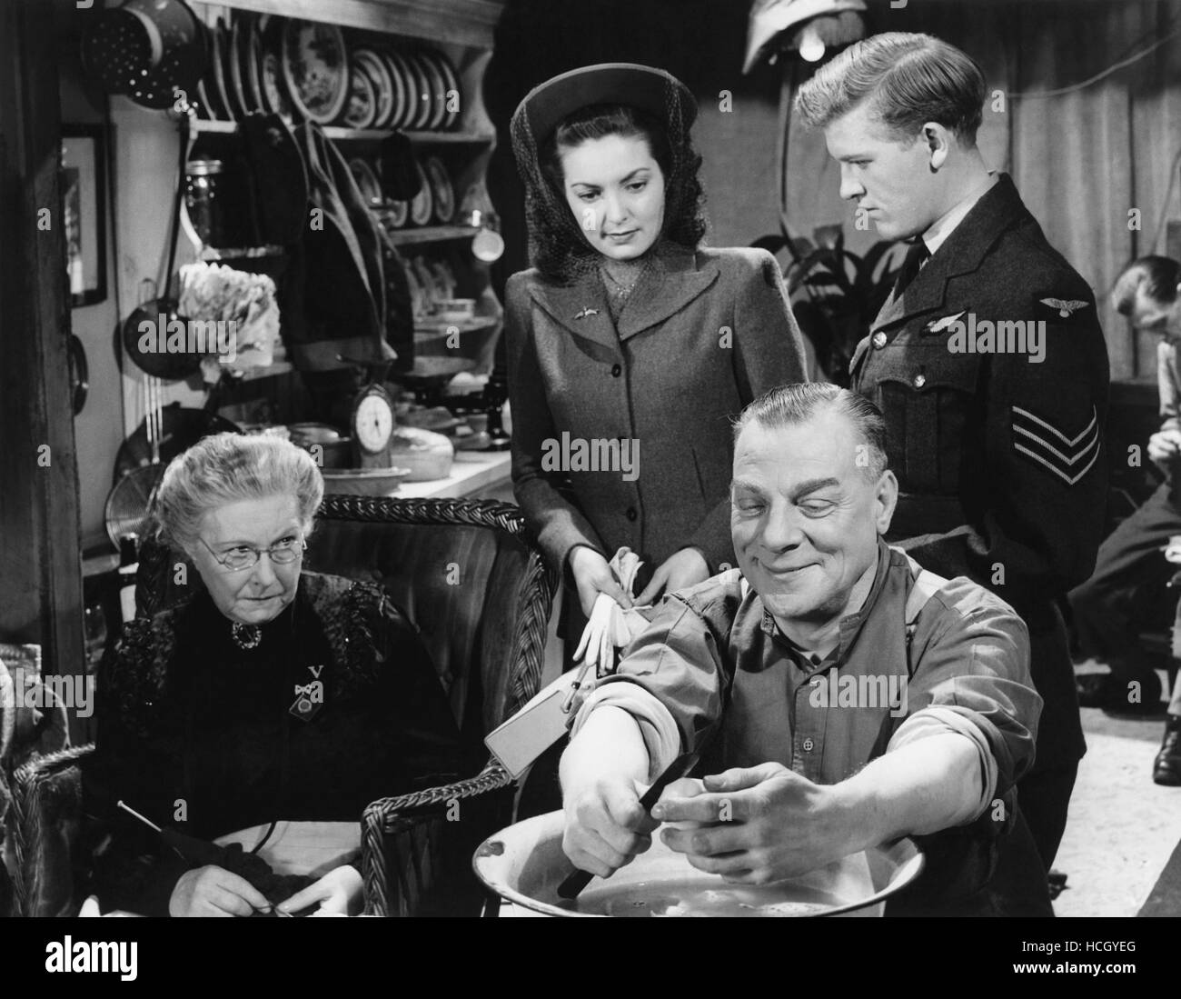 MILLIONS LIKE US, seated from left: Amy Veness, Jack Vyvian, standing ...