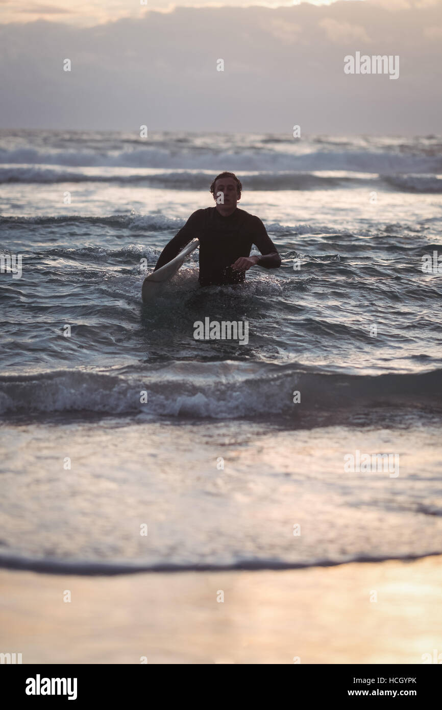 Man carrying surfboard hi-res stock photography and images - Alamy