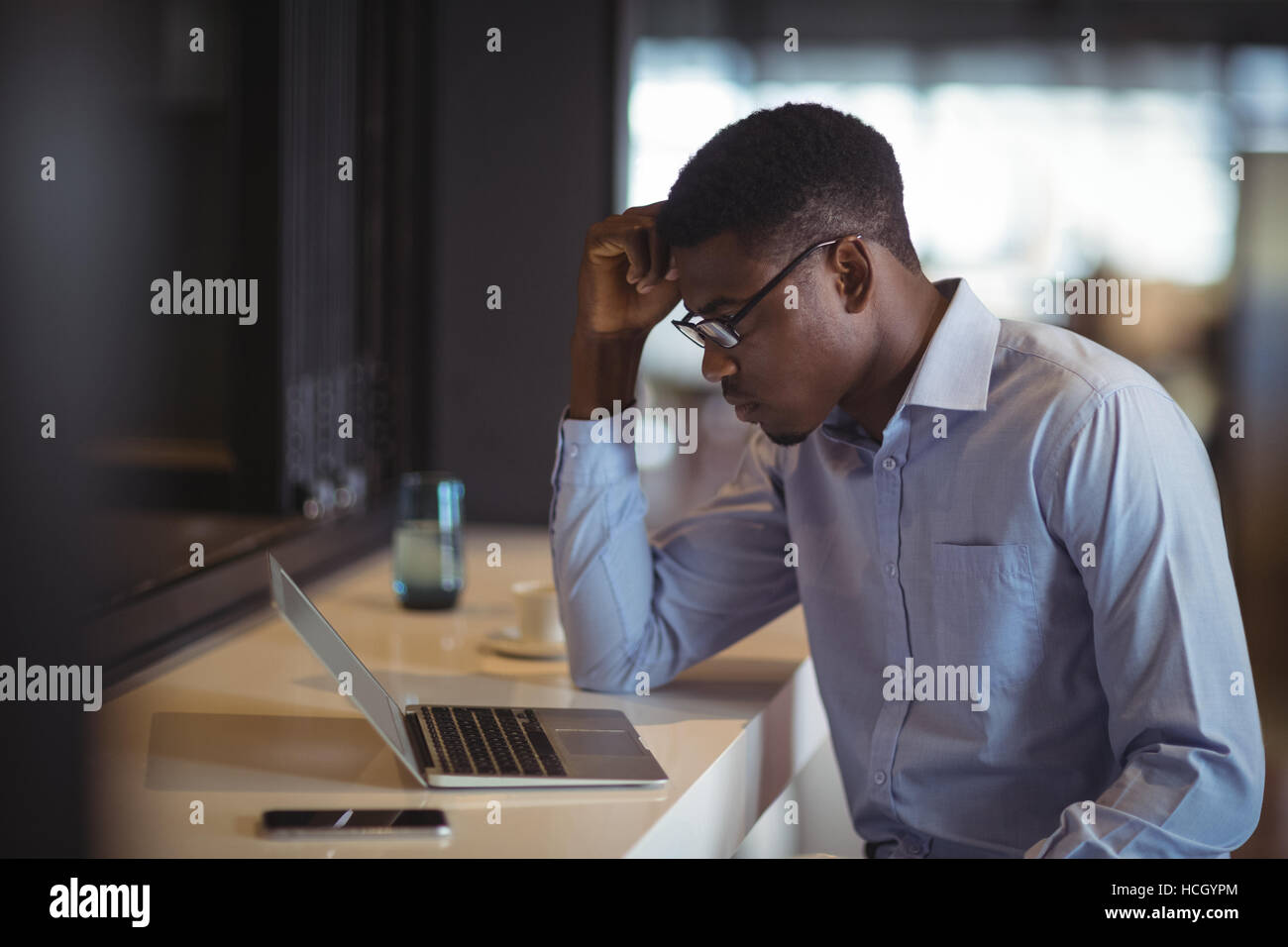 Businessman using laptop Stock Photo - Alamy
