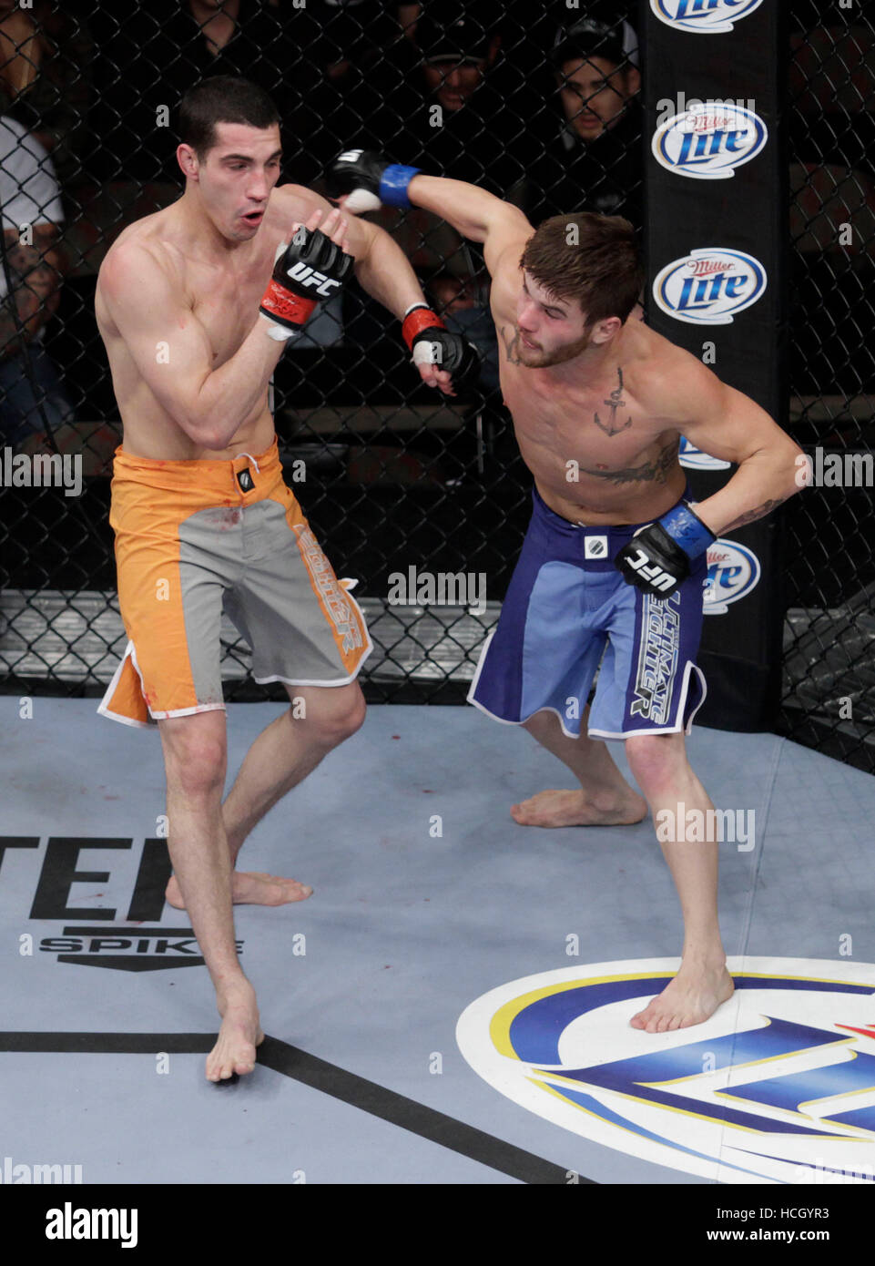 Roland Delorme, left, fights Josh Ferguson at The Ultimate Fighter 14 ...