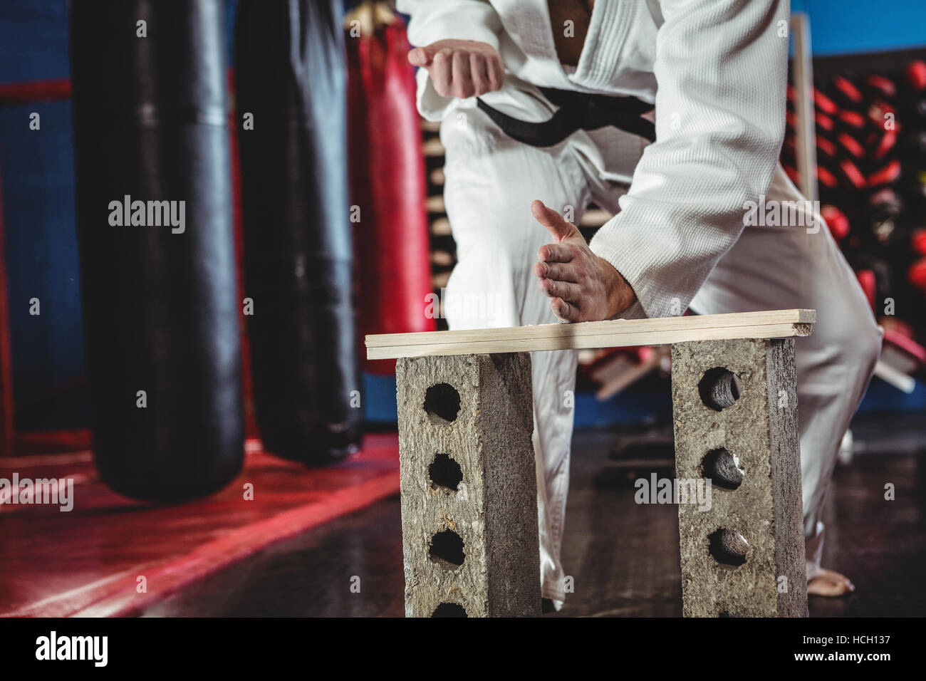Karate player breaking wooden plank Stock Photo - Alamy Karate player breaking wooden plank Stock Photo - Alamy