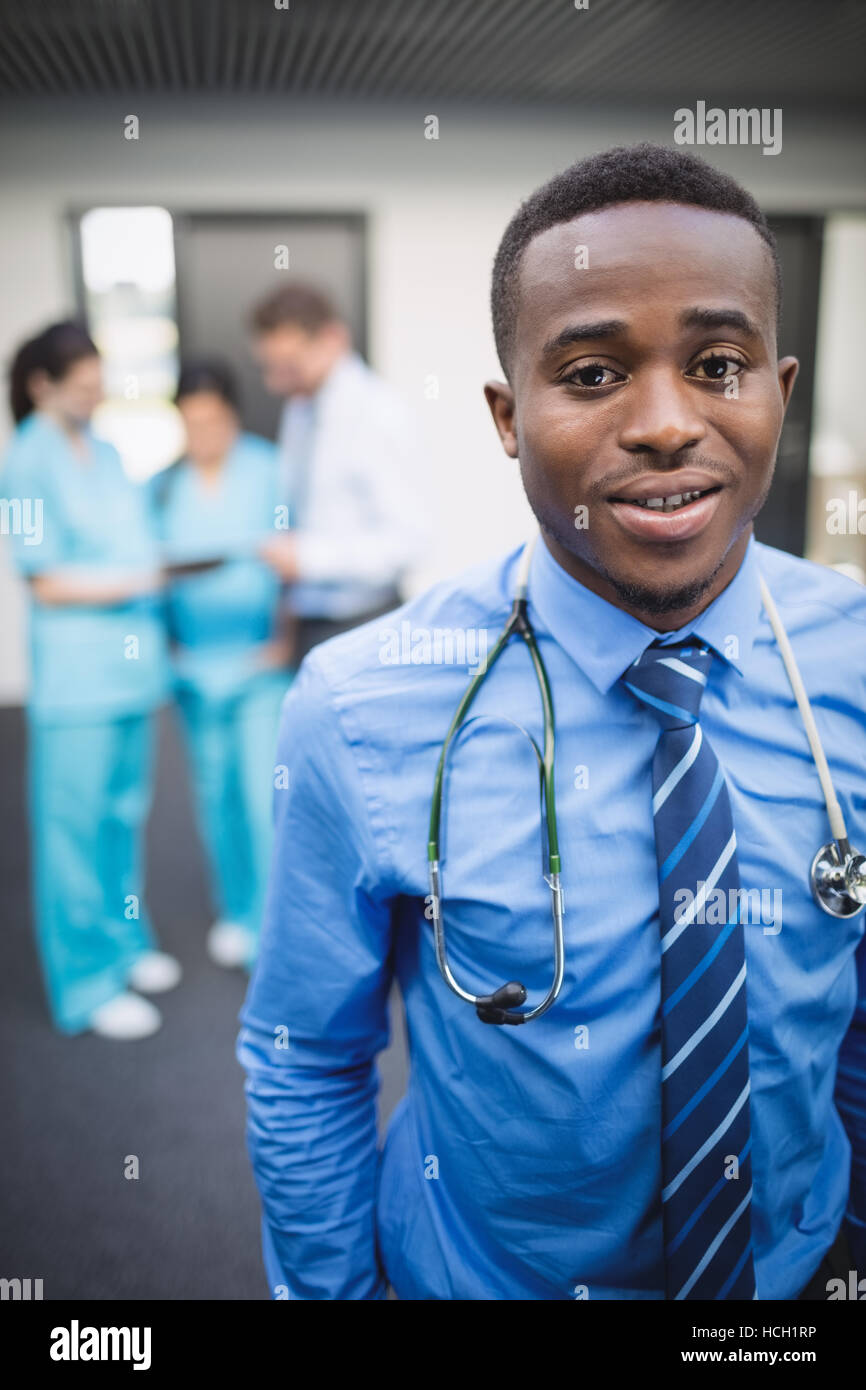 Doctor standing in hospital corridor Stock Photo - Alamy