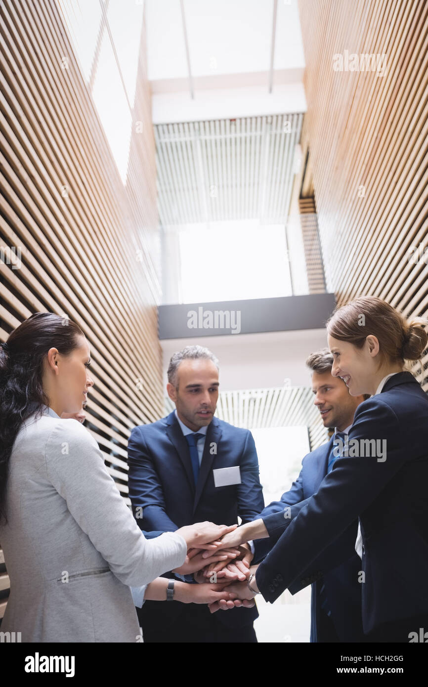 Businesspeople stacking hands together Stock Photo - Alamy