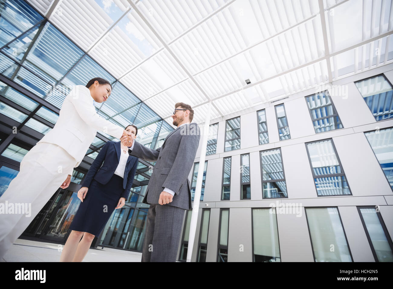 Shaking hands asian woman hi-res stock photography and images - Alamy