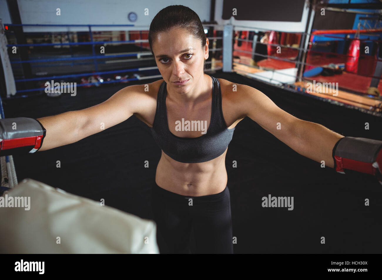 Confident female boxer standing in boxing ring Stock Photo - Alamy