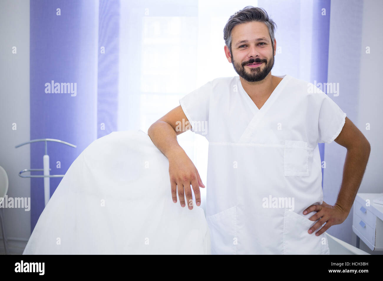 Doctor in medical uniform standing hi-res stock photography and images ...