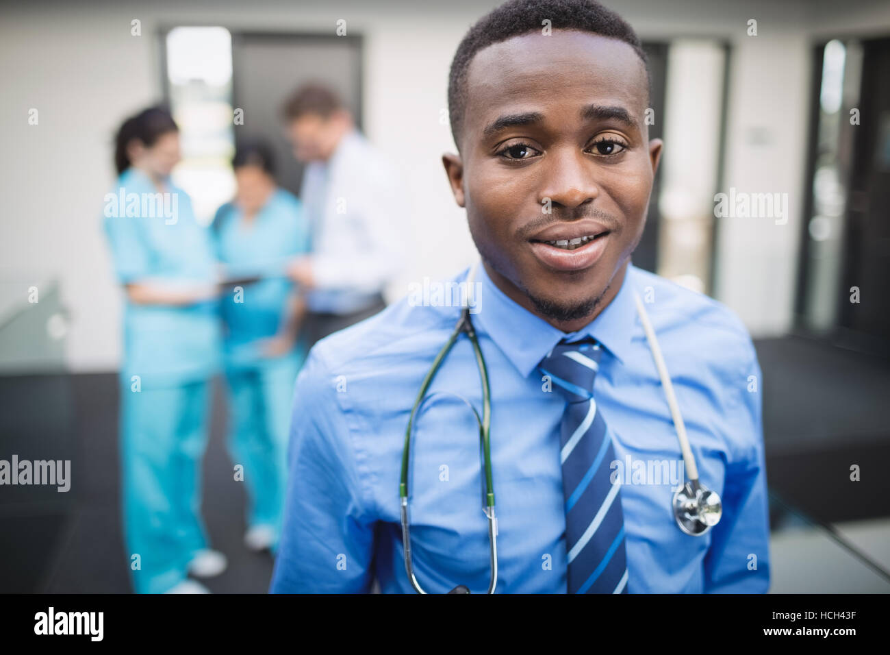 Doctor standing in hospital corridor Stock Photo - Alamy