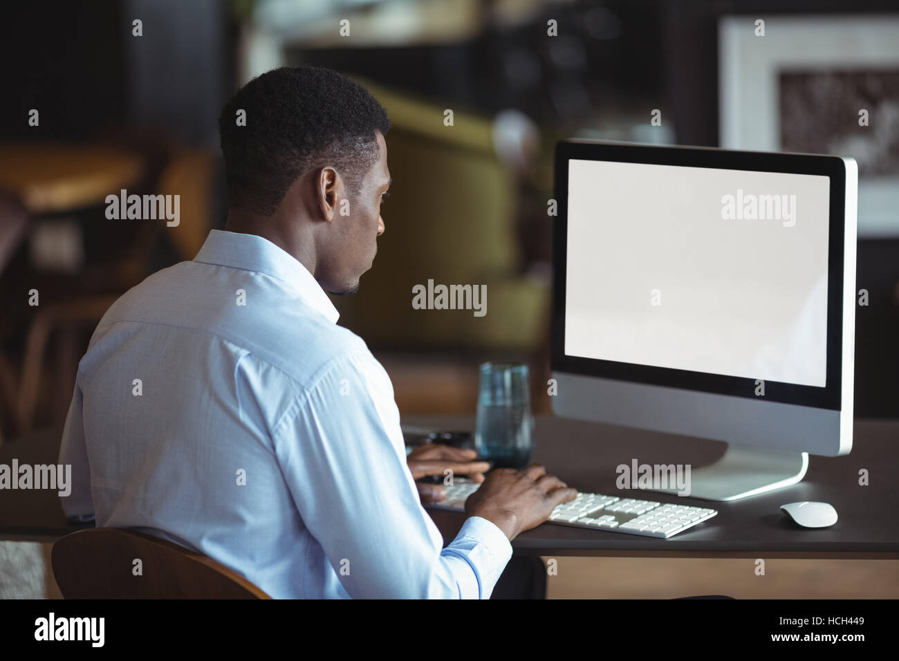 Businessman working over computer Stock Photo - Alamy