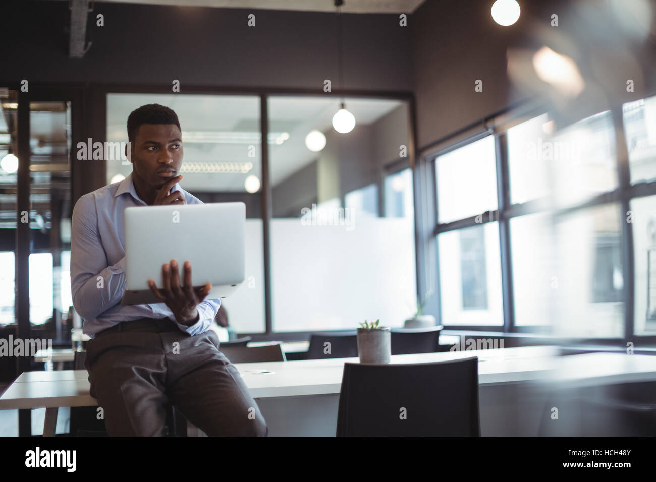 Businessman working over laptop Stock Photo - Alamy