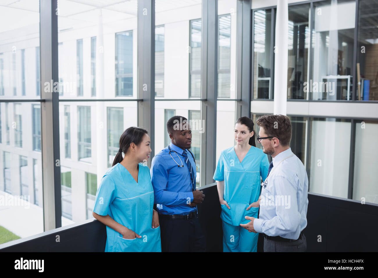 Doctors and nurse interacting with each other Stock Photo - Alamy