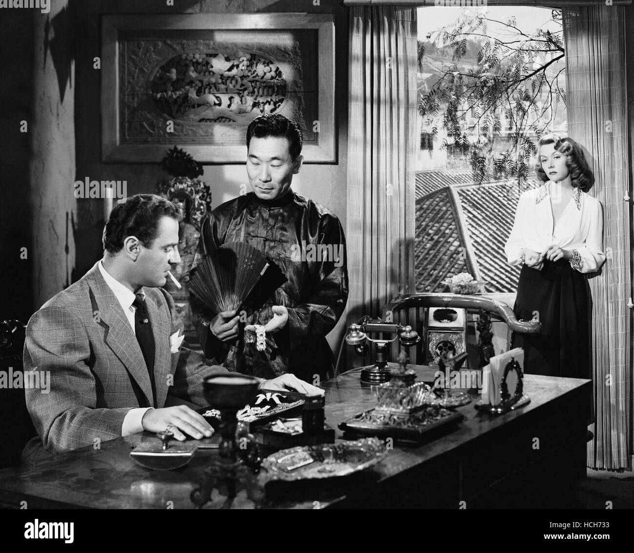 MACAO, from left: Brad Dexter, Philip Ahn, Gloria Grahame, 1952 Stock ...