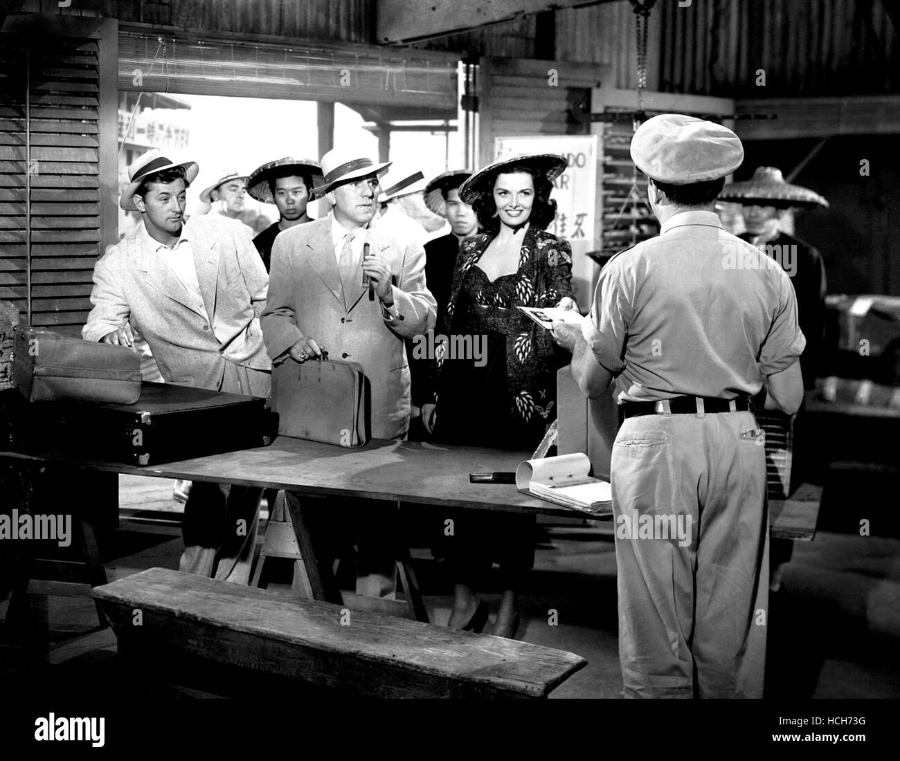 MACAO, on line from left: Robert Mitchum, William Bendix, Jane Russell ...