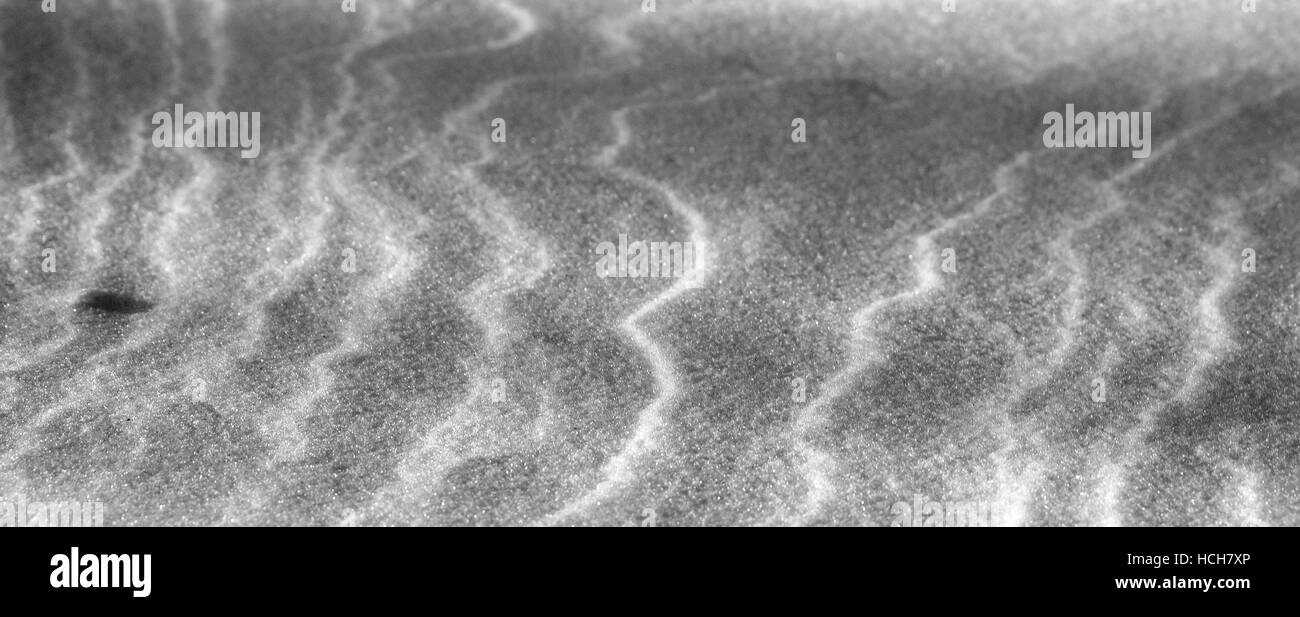 Snowy landscape with ripple effect caused by wind Stock Photo - Alamy